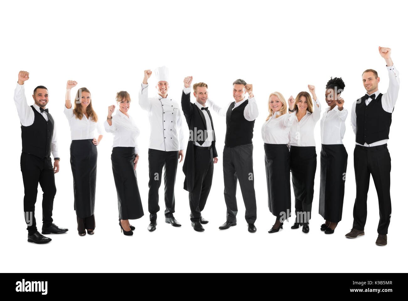Full length portrait of happy restaurant staff celebrating success ...
