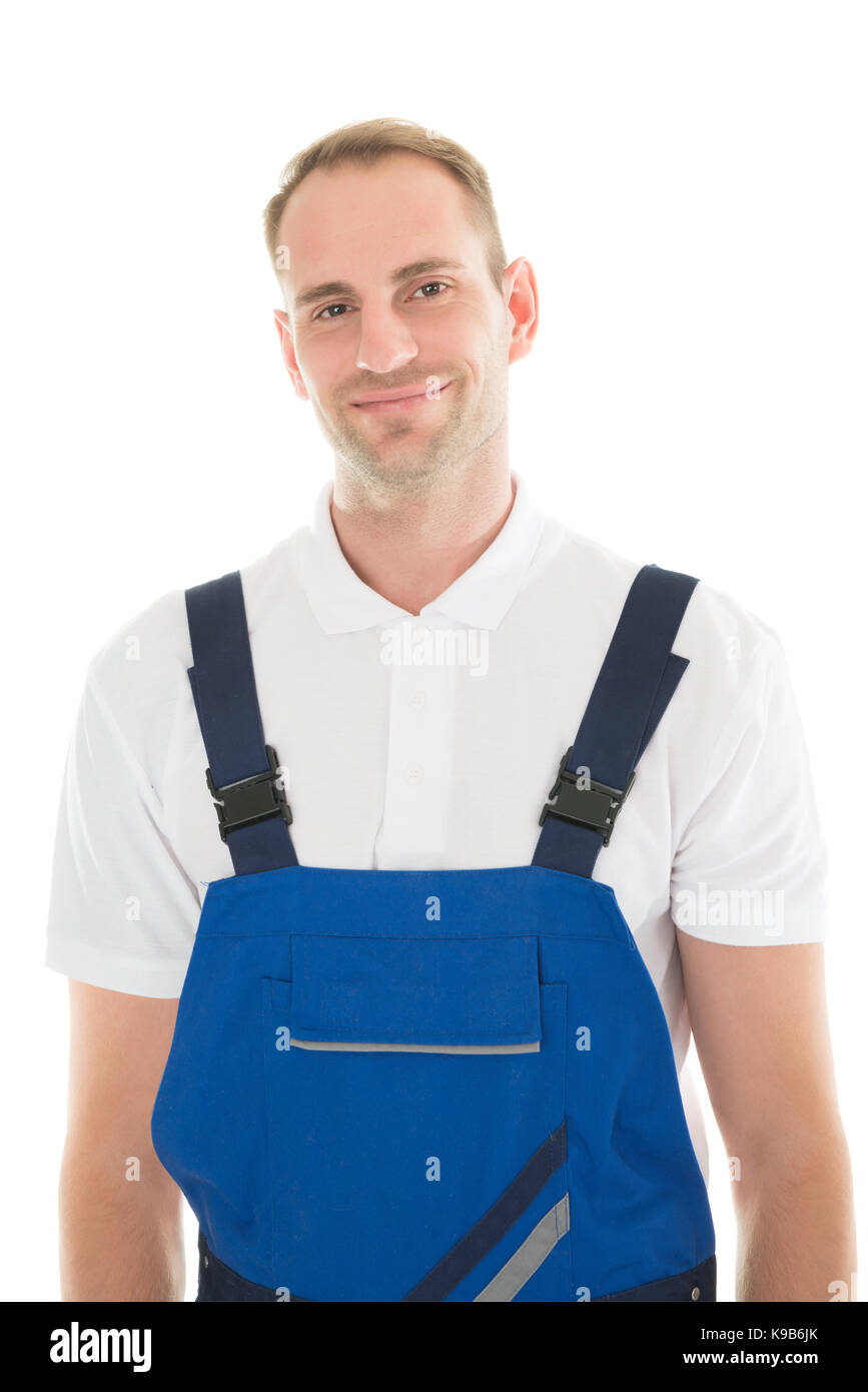 Portrait of smiling mid adult male janitor standing against white ...