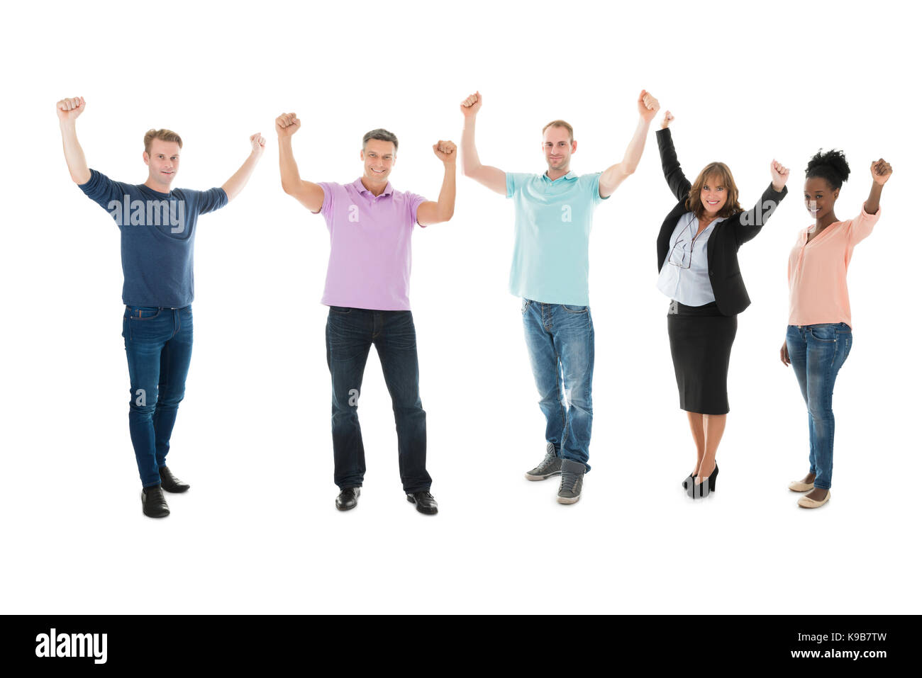 Full length portrait of creative business people with arms raised ...