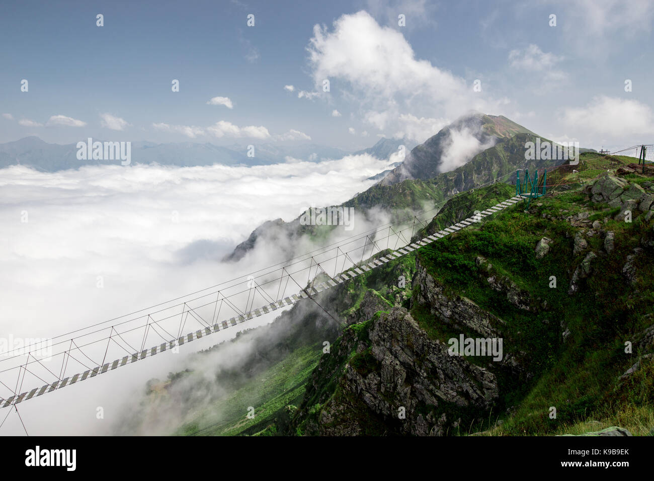 Beautiful clouds and fog among mountain landscape Stock Photo - Alamy