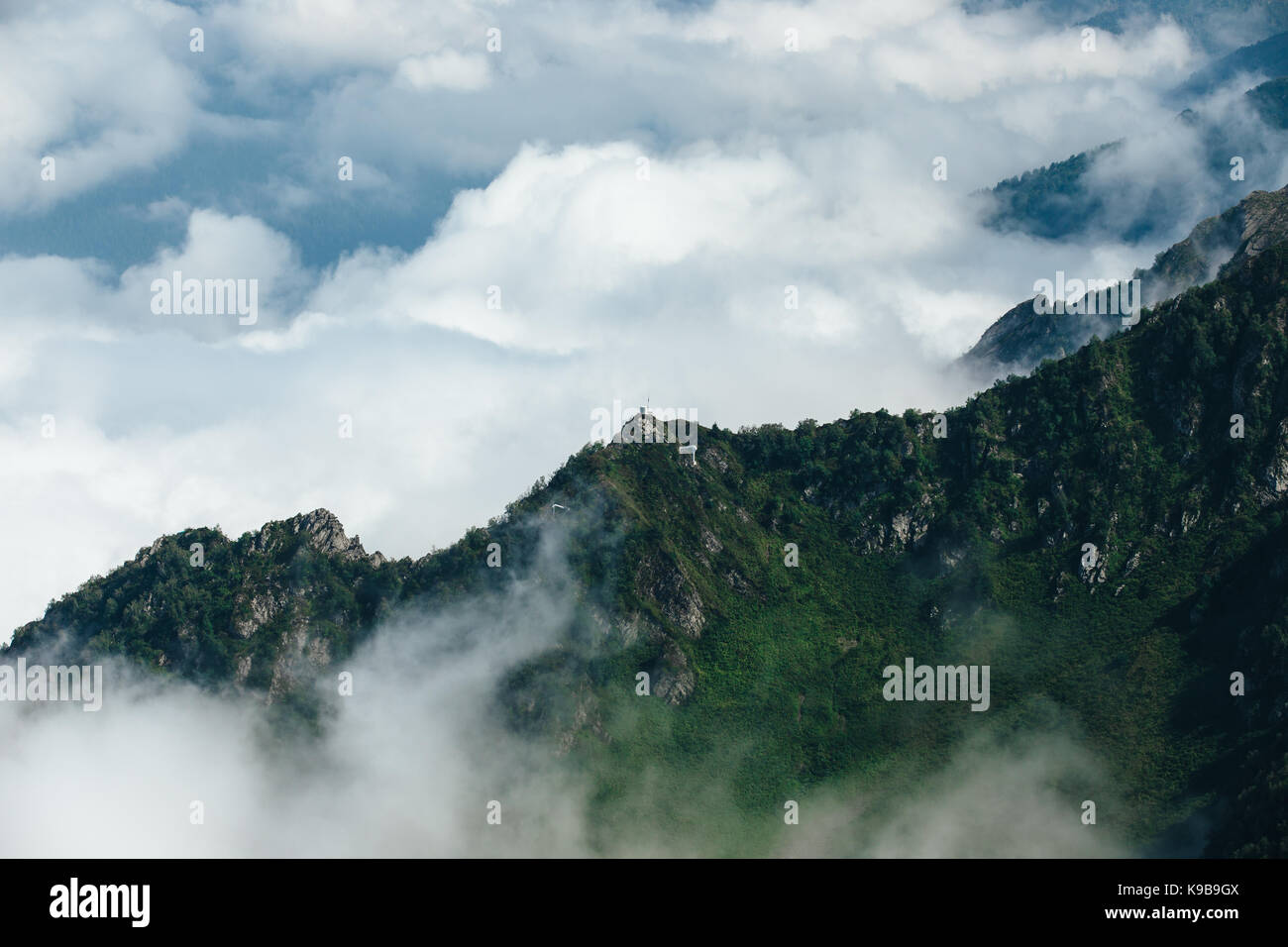 Beautiful clouds and fog among mountain landscape Stock Photo - Alamy