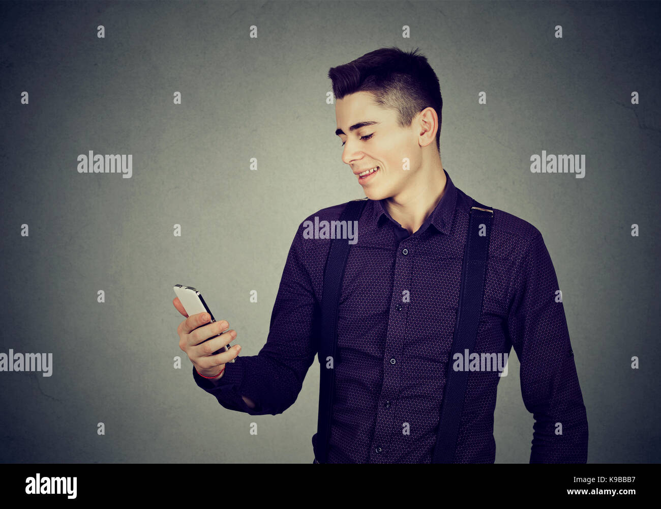 Young man using a mobile phone Stock Photo - Alamy