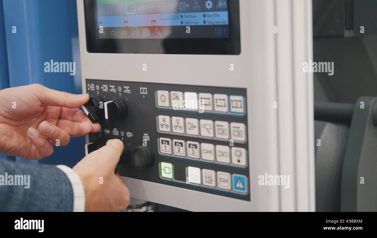 Energy security - system management panel. Man worker manipulates for ...