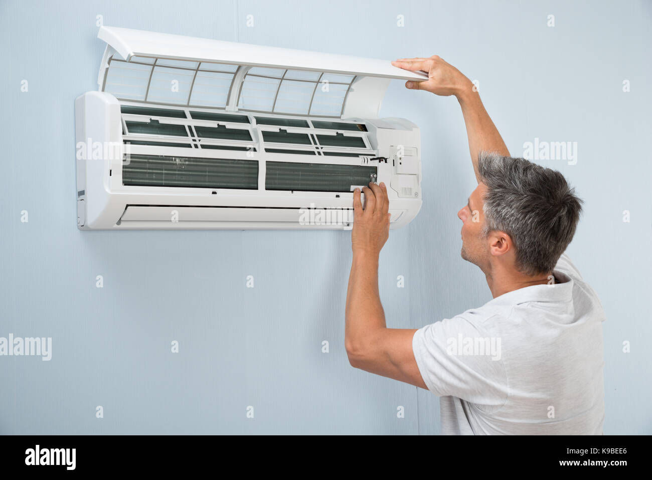Portrait Of A Man Cleaning Air Conditioning System Stock Photo - Alamy