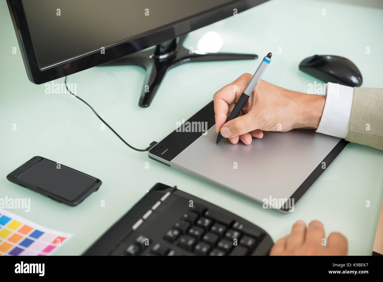 Close-up Of A Businessman Using Graphic Tablet In Office Stock Photo ...