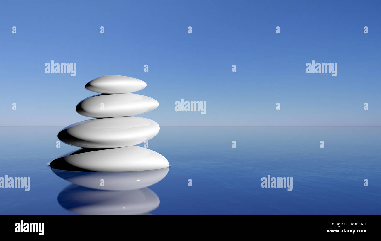 Zen stones in the blue water Stock Photo - Alamy