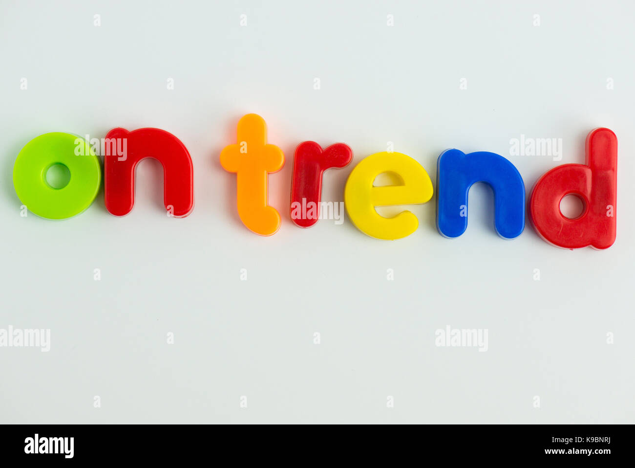 on trend word in colourful children's letters Stock Photo - Alamy