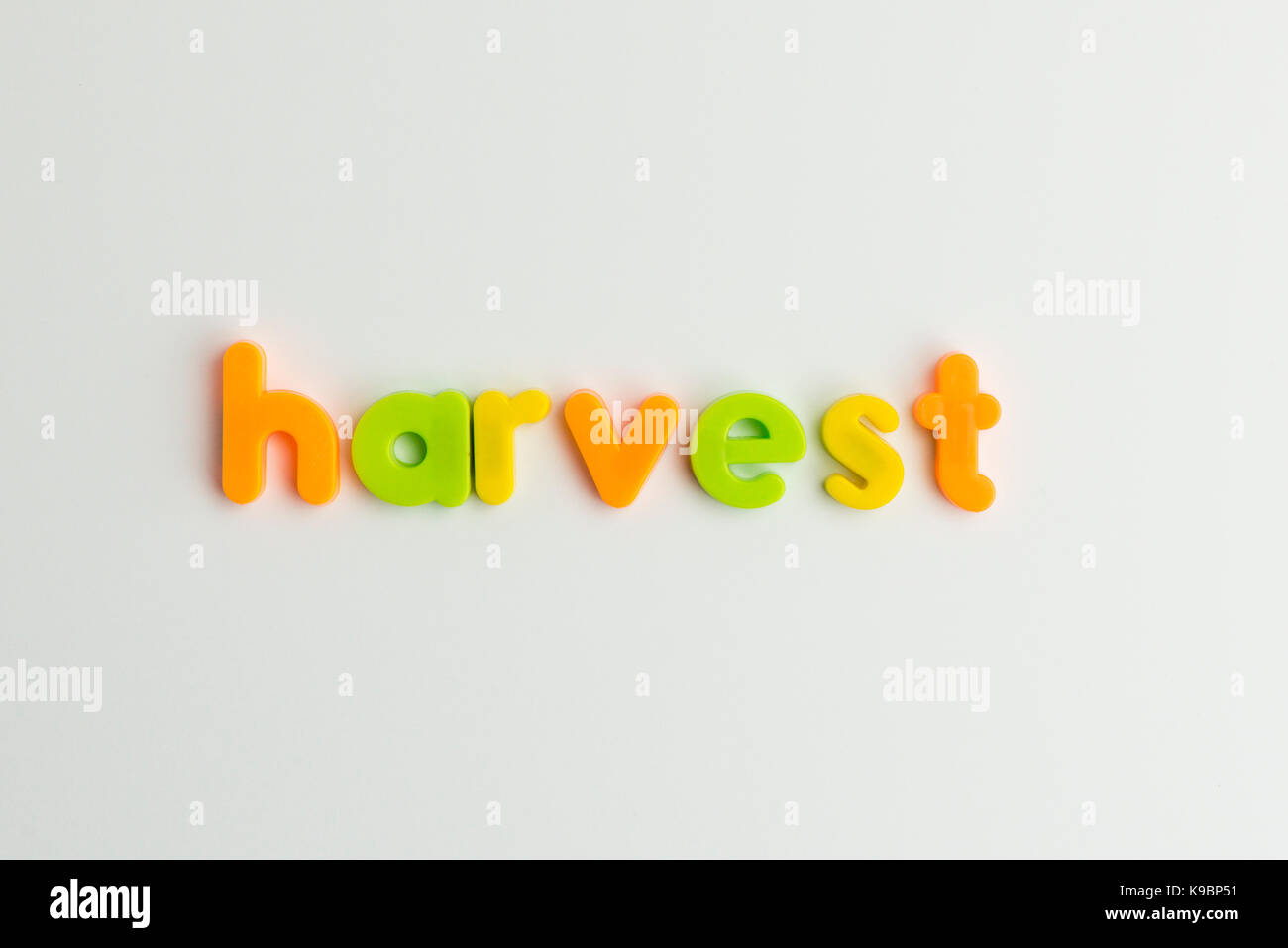 harvest word in colourful children's letters Stock Photo - Alamy