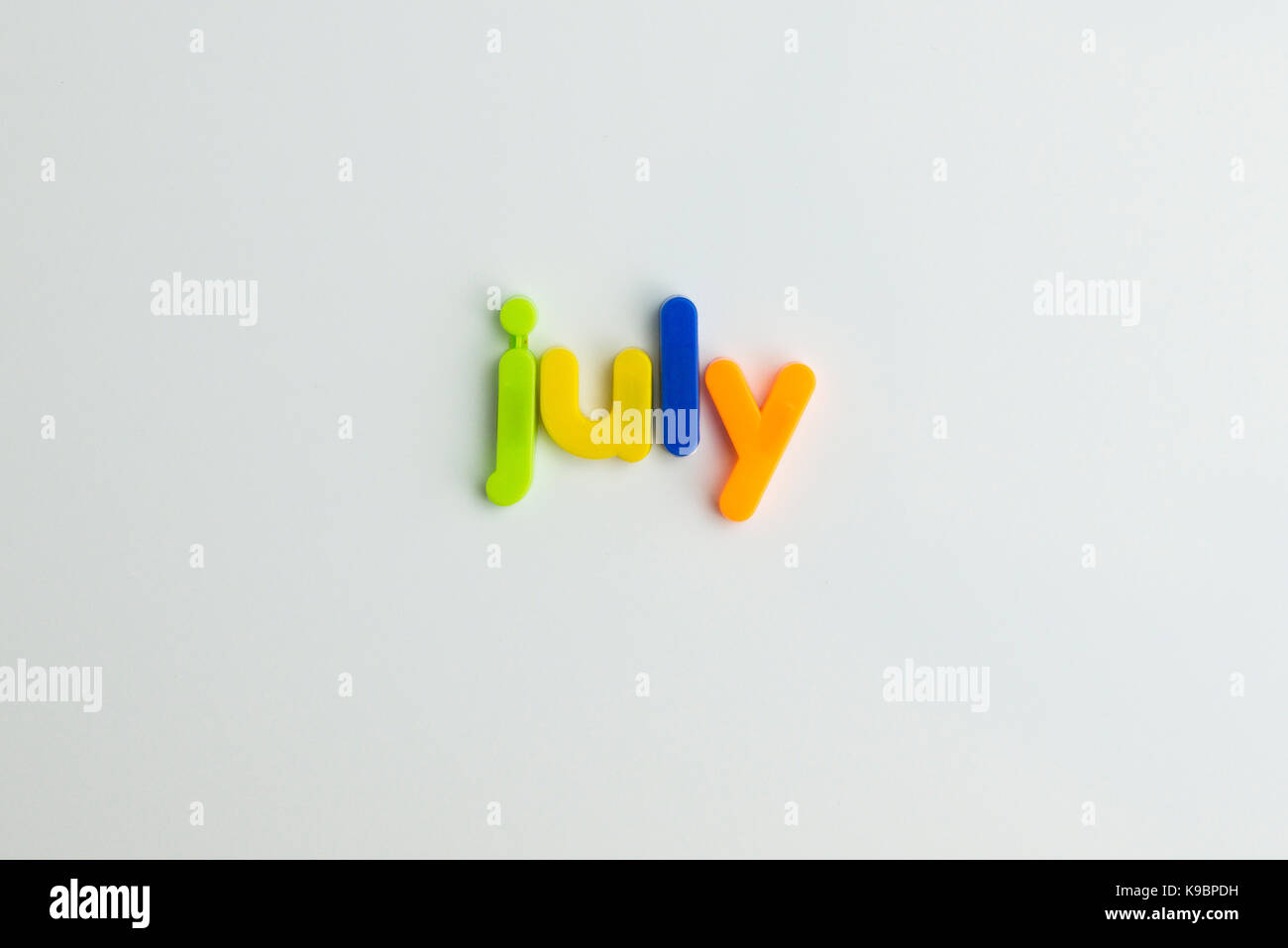 july word in colourful children's letters Stock Photo - Alamy