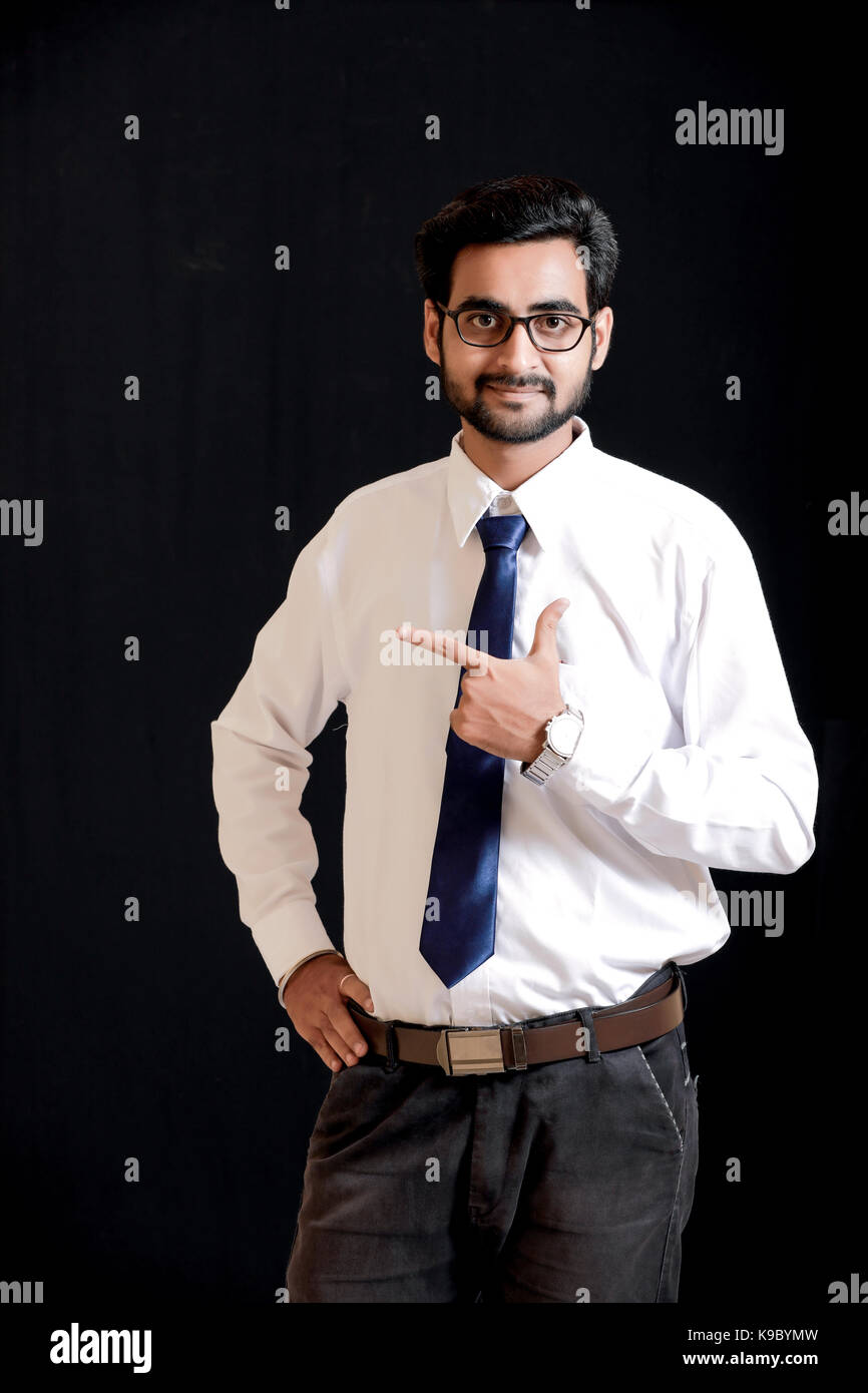 Indian young man showing direction with hand Stock Photo - Alamy