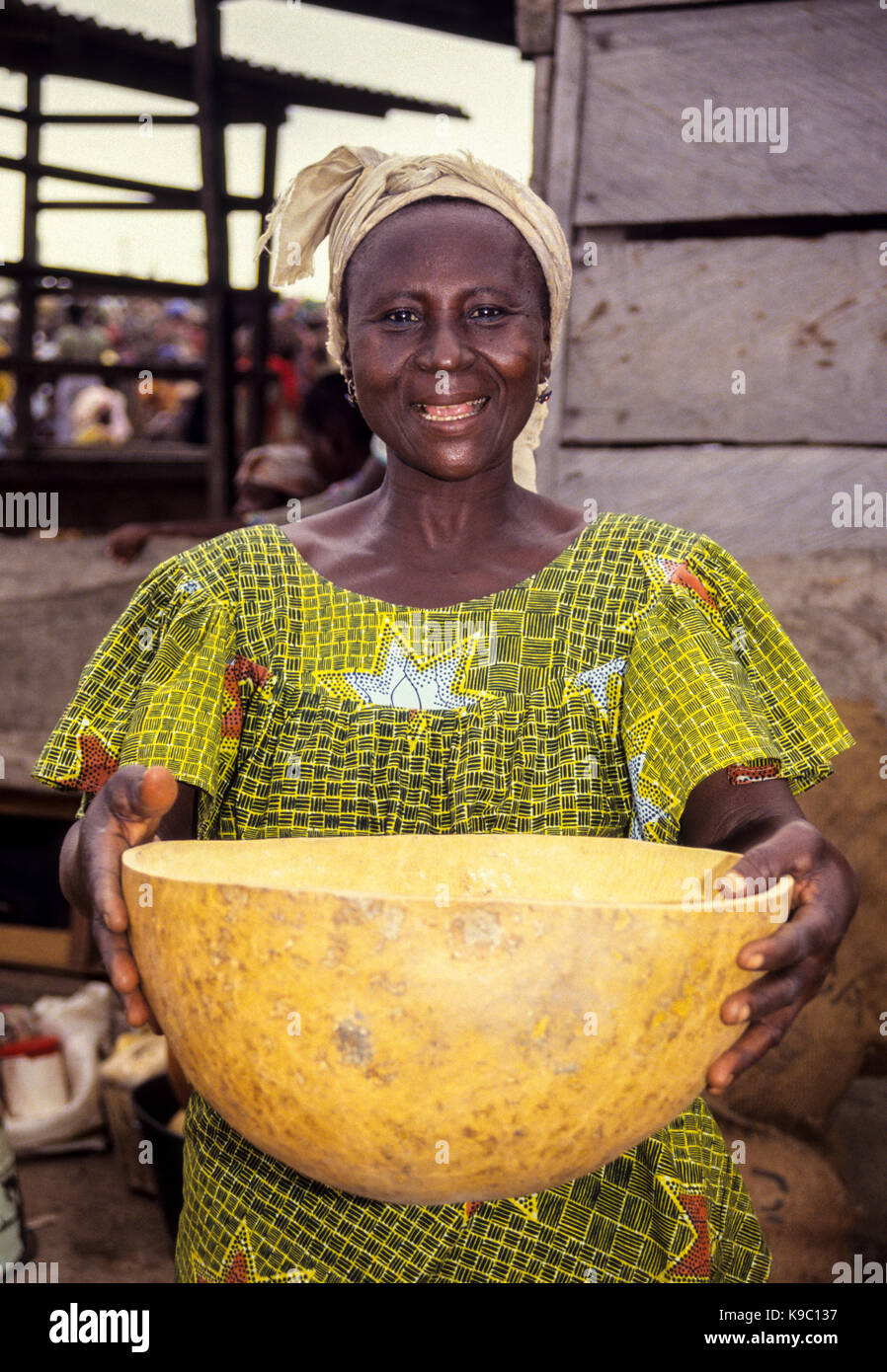 Bondoukou Ivory Coast Cote Divoire Woman Offering A Calabash Bowl For Sale In The Market