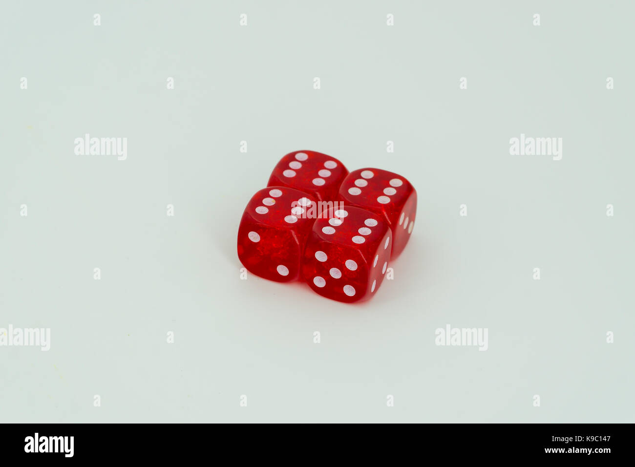 four red dices isolated Stock Photo - Alamy