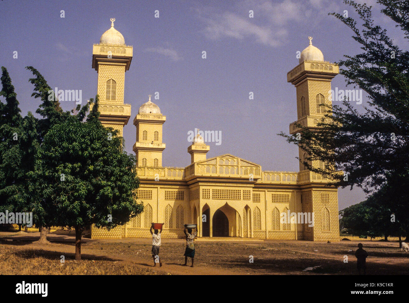 Korhogo, Ivory Coast, Cote d'Ivoire. Girls Carrying Water in the Mosque ...