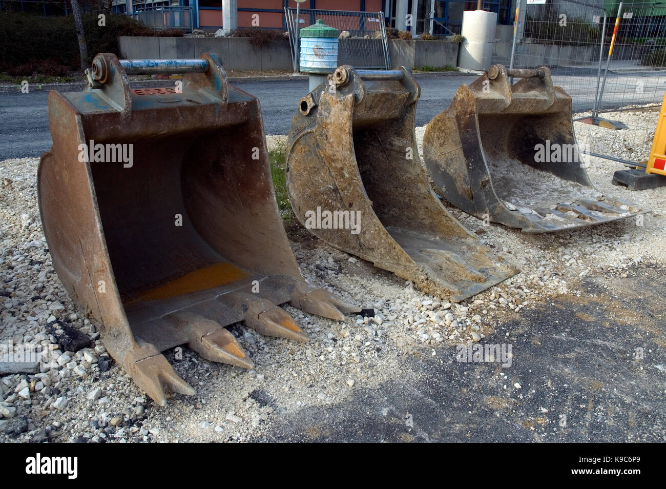 dredger buckets at construction site Stock Photo - Alamy