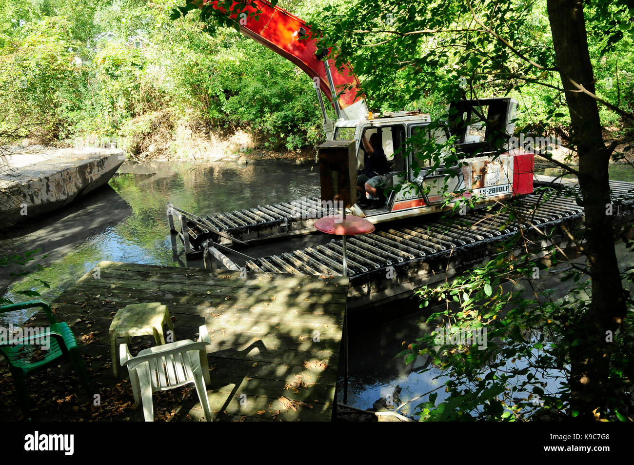 Dredging equipment clearing bottom silt out of river channel Stock ...