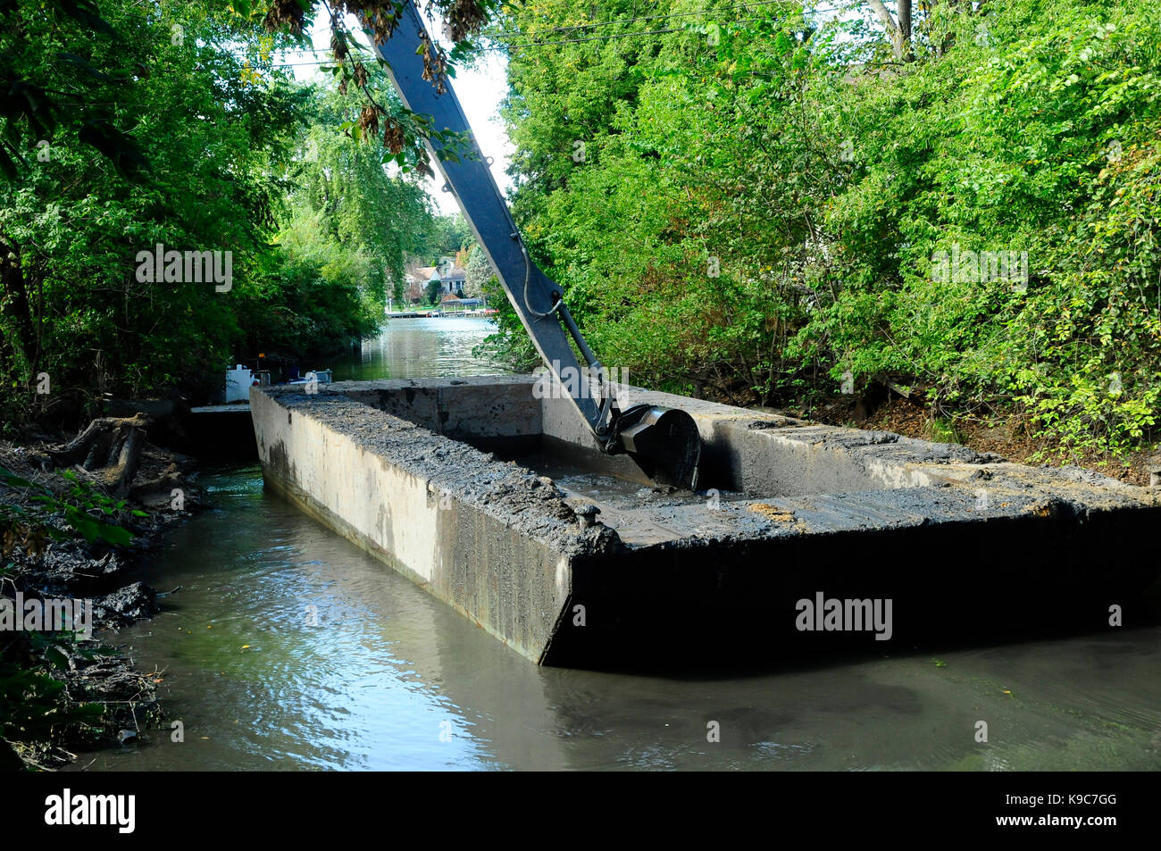 Dredging equipment clearing bottom silt out of river channel Stock ...
