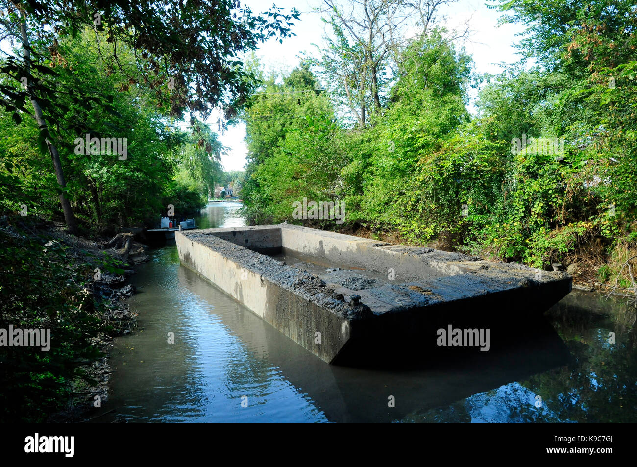 Dredging equipment clearing bottom silt out of river channel Stock ...