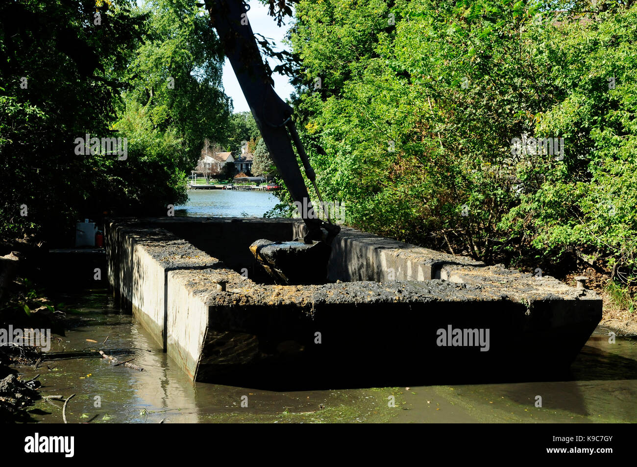 Dredging equipment clearing bottom silt out of river channel Stock ...