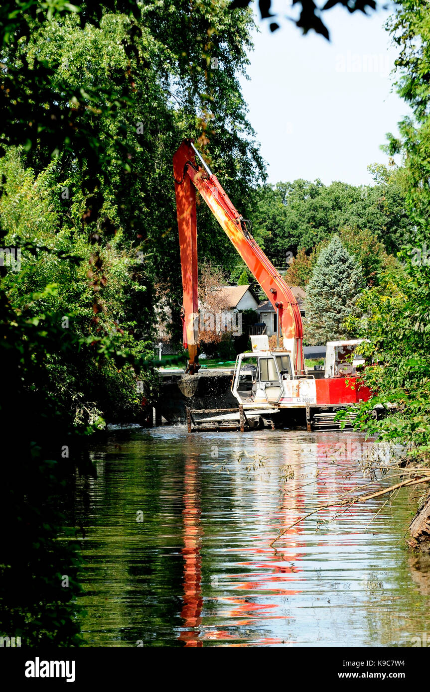 Dredging equipment clearing bottom silt out of river channel Stock ...