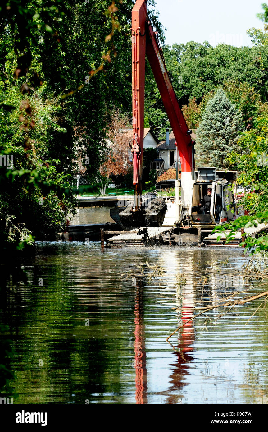 Dredging equipment clearing bottom silt out of river channel Stock ...