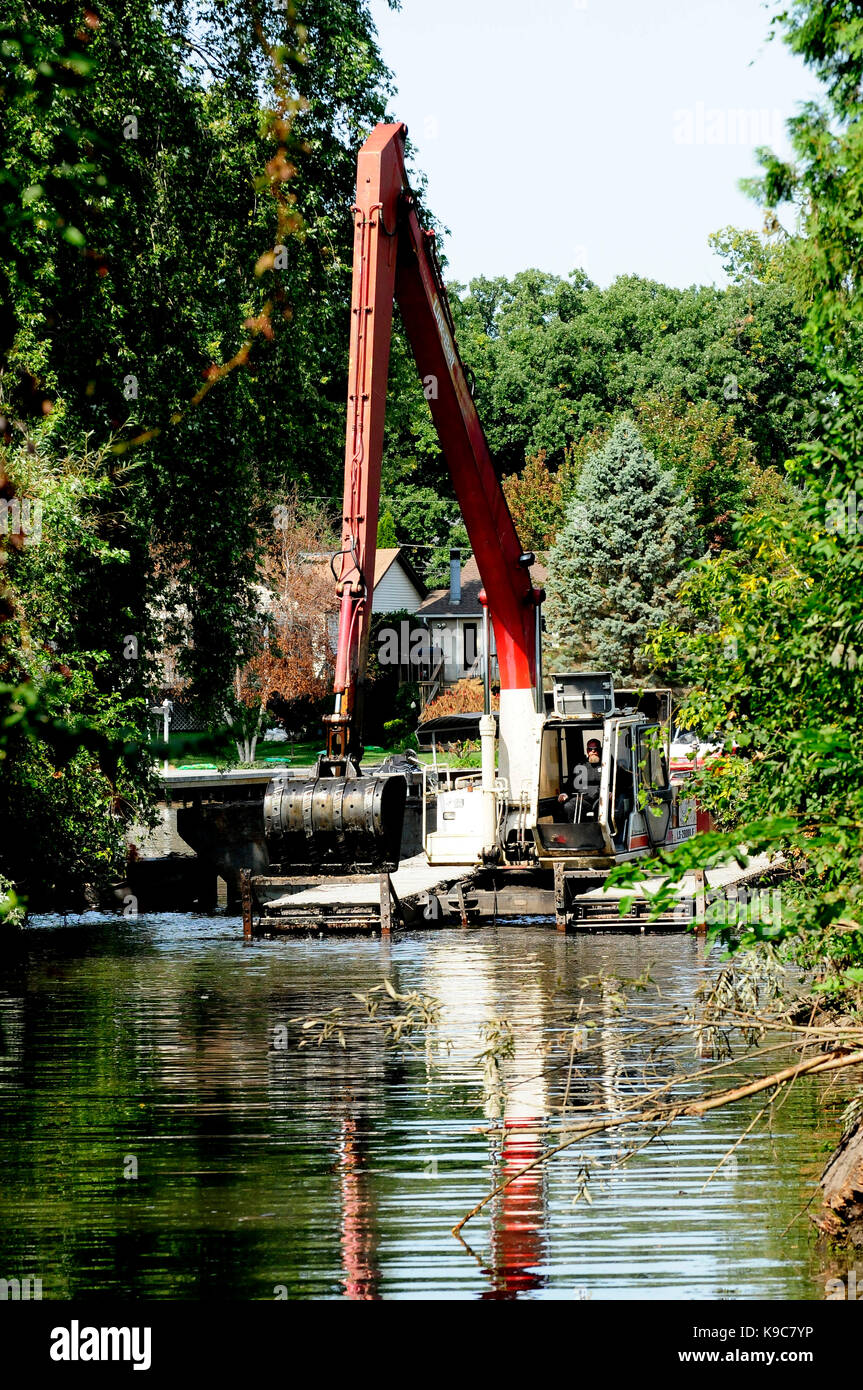 Dredging equipment clearing bottom silt out of river channel Stock ...