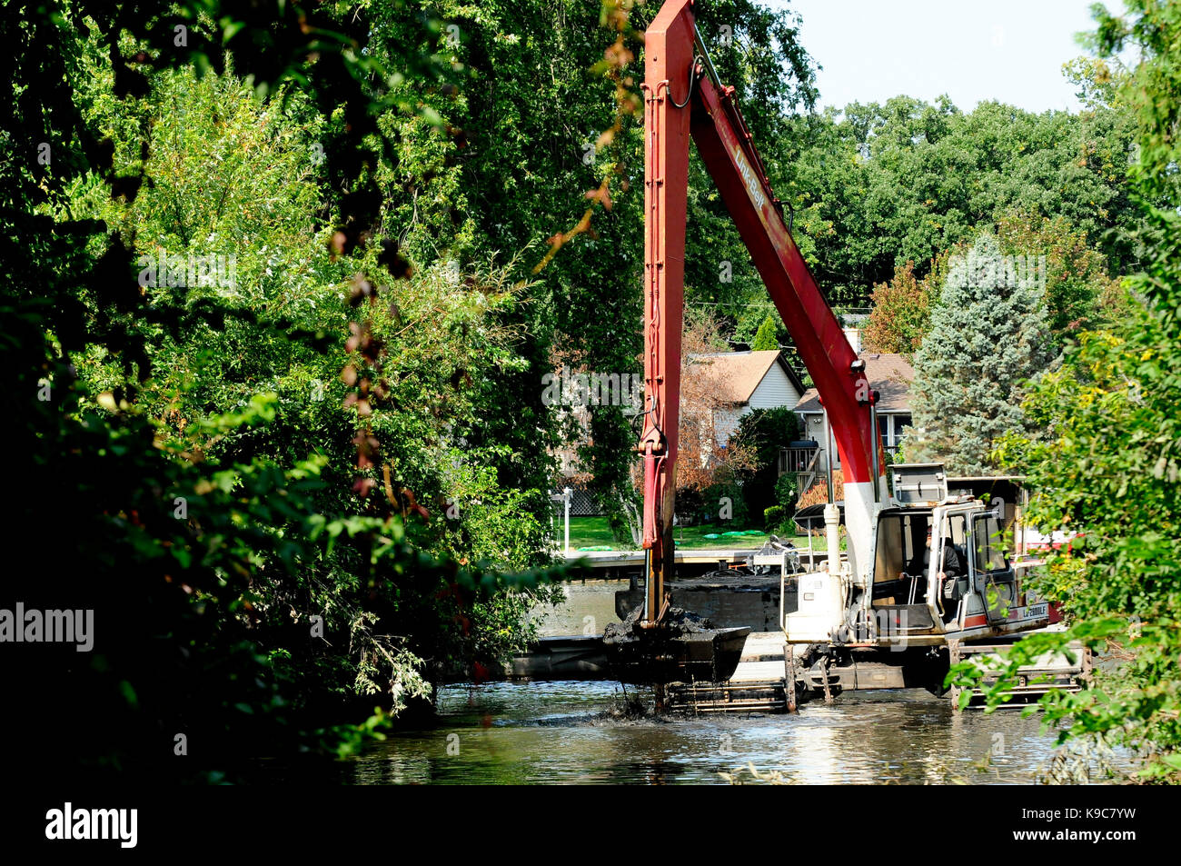 Dredging equipment clearing bottom silt out of river channel Stock ...