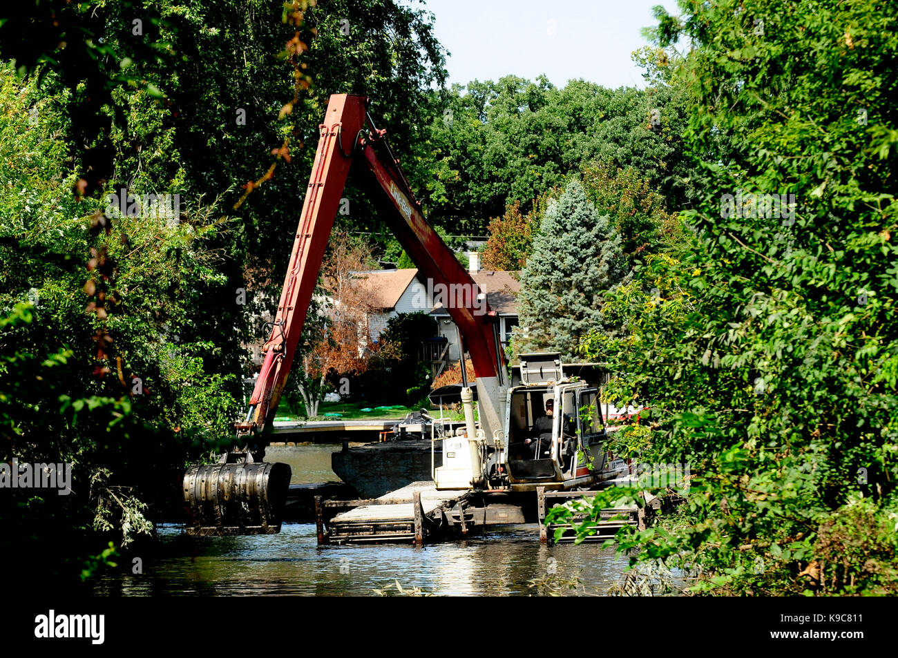 Dredging equipment clearing bottom silt out of river channel Stock ...