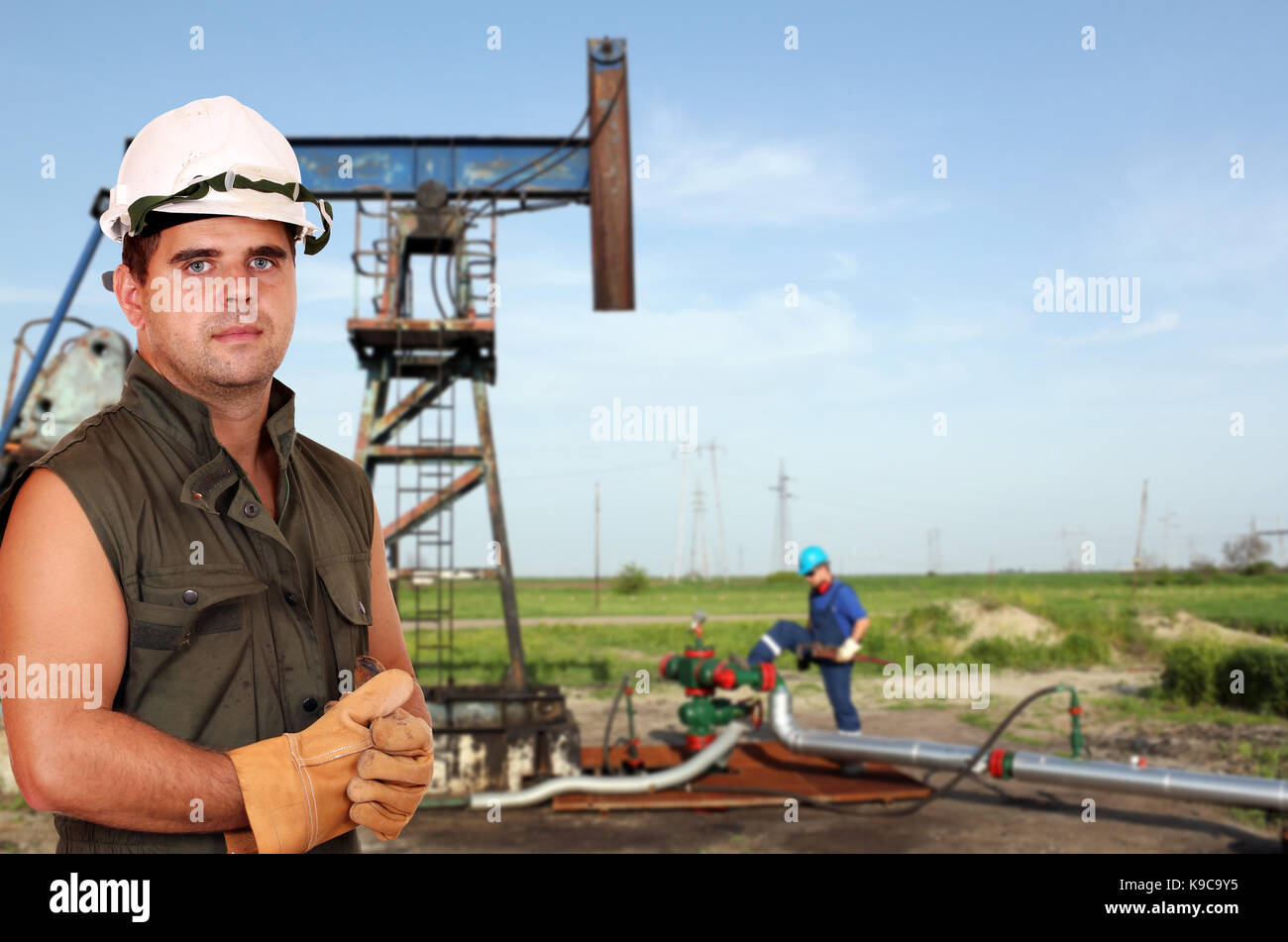 oil workers on oilfield Stock Photo - Alamy