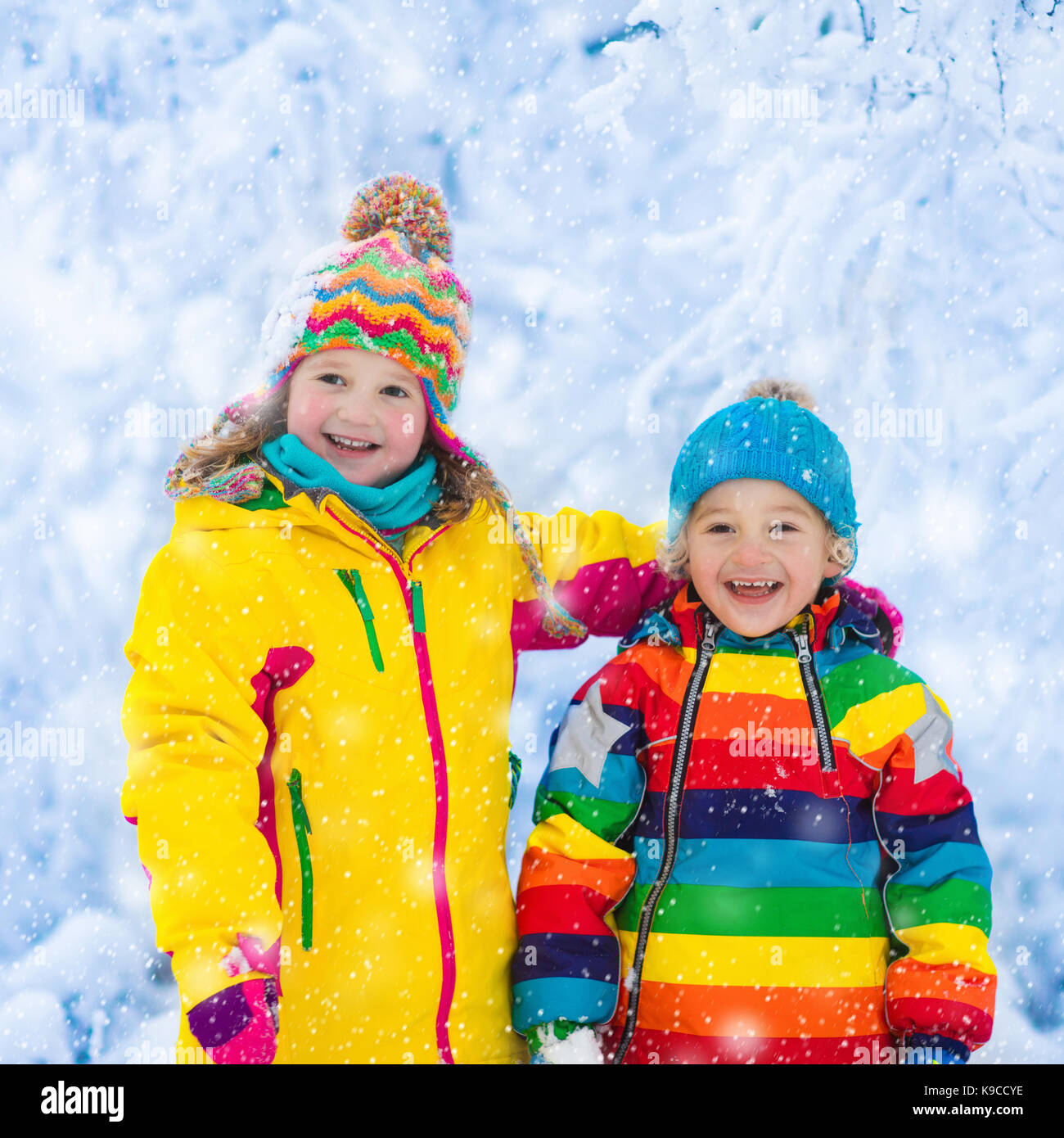 Children playing in the snow christmas hi-res stock photography and ...