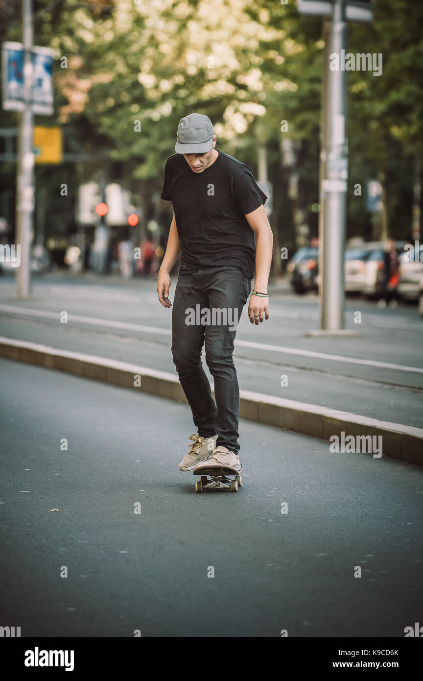 Pro skateboarder ride skateboard on the capital city road streets ...