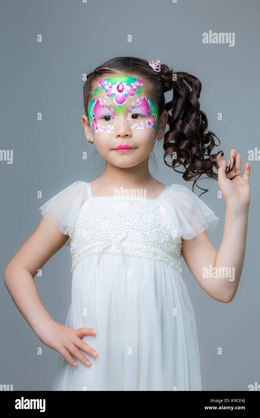 beautiful little girl with a painted face. face painting Stock Photo ...