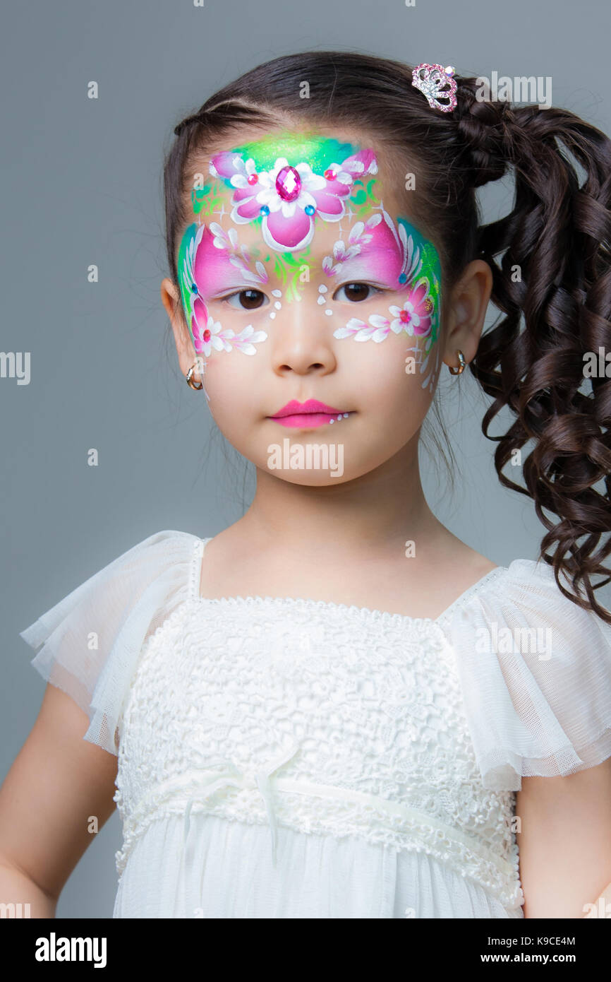 beautiful little girl with a painted face. face painting Stock Photo ...
