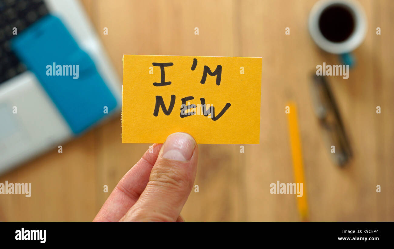 I'm new written on a card at the office Stock Photo - Alamy