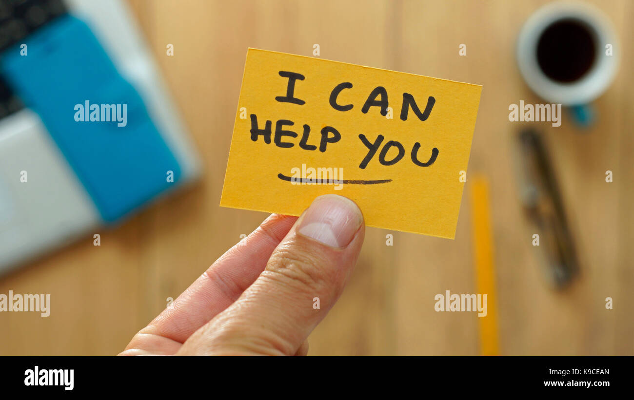 I can help you written on a card at the office Stock Photo - Alamy