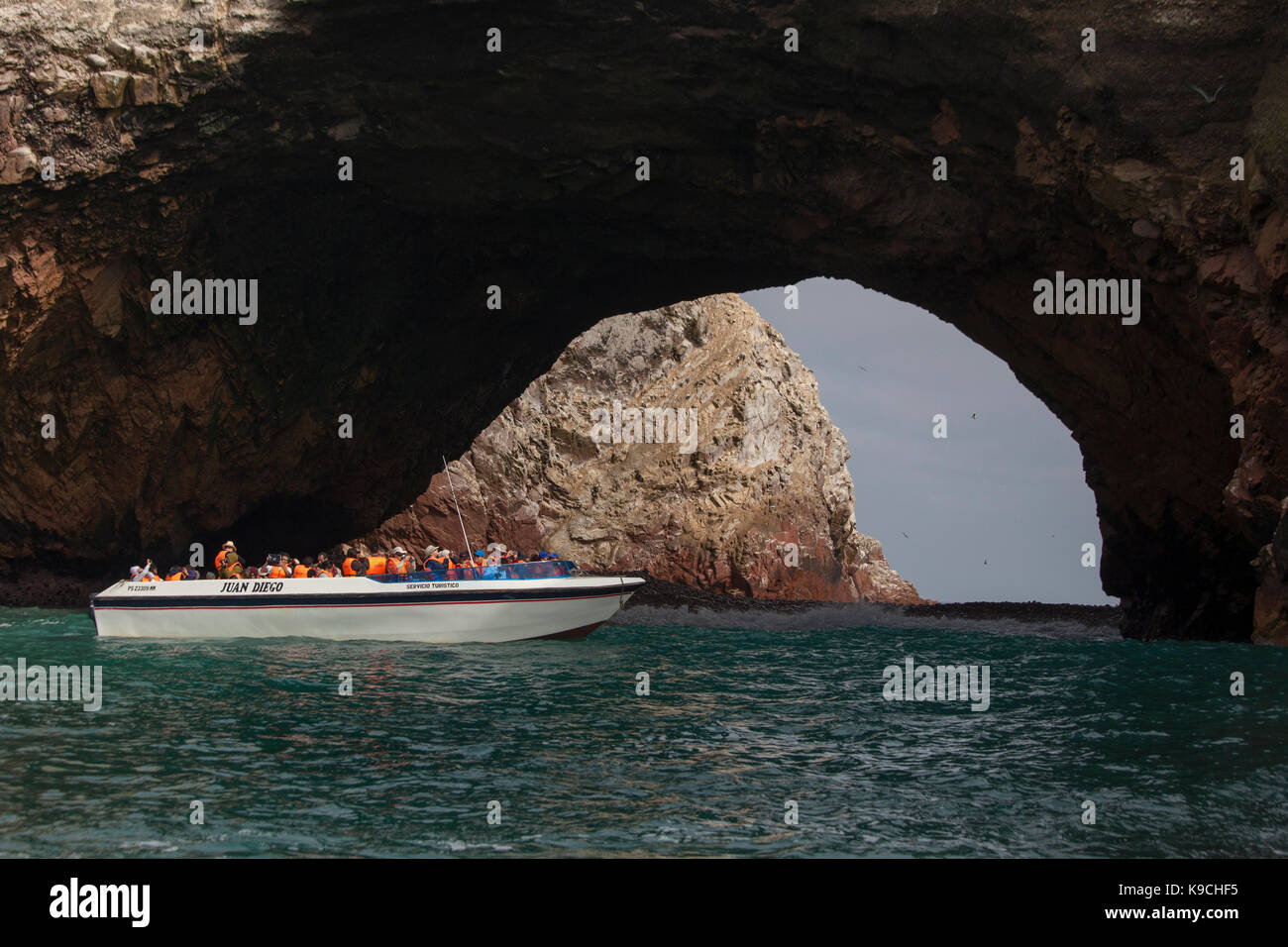 PARACAS, PERU-JULY 7,2014: Unidentified people look at rocks at the ...