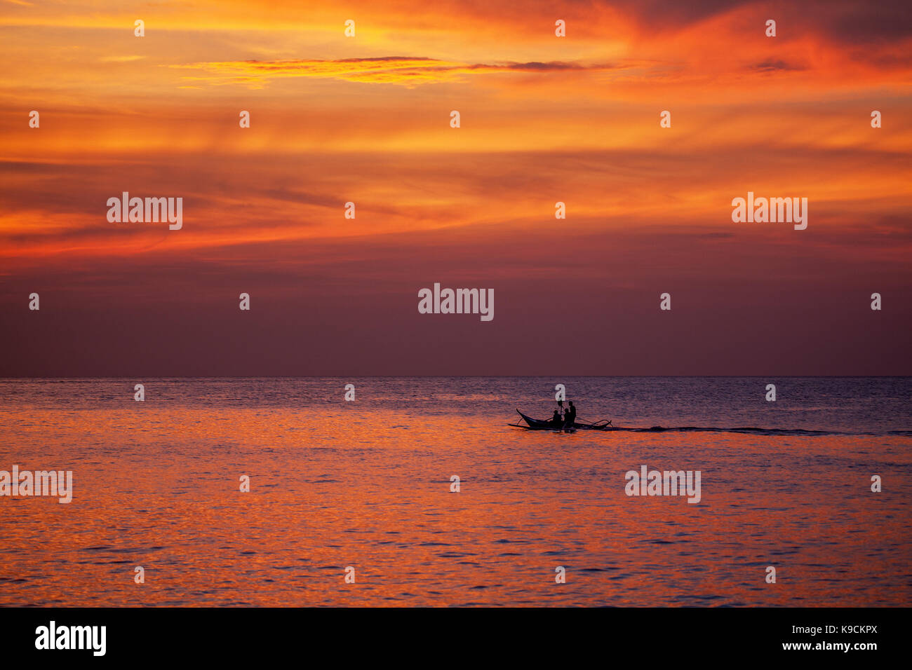 Blazing, brilliant colorful sunset on the Verde Strait separating Luzon ...