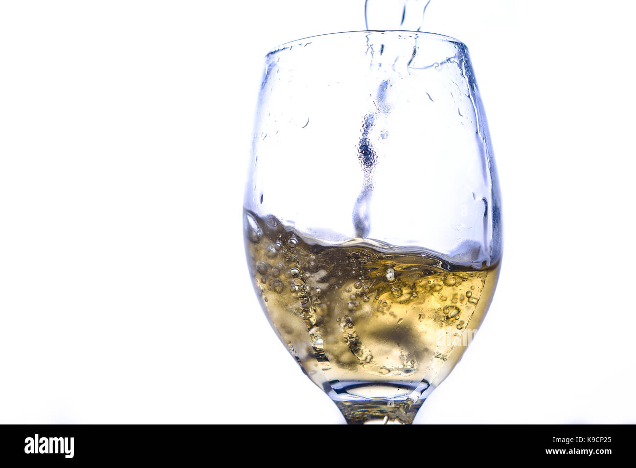 Art of water pouring and splashing in the wine glass Stock Photo - Alamy