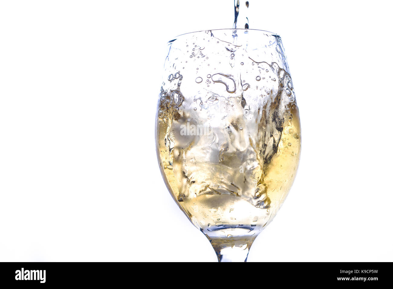 Art of water pouring and splashing in the wine glass Stock Photo - Alamy