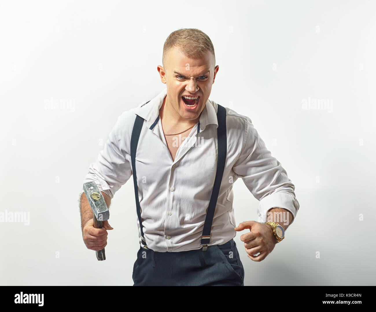 Angry man with hammer Stock Photo - Alamy