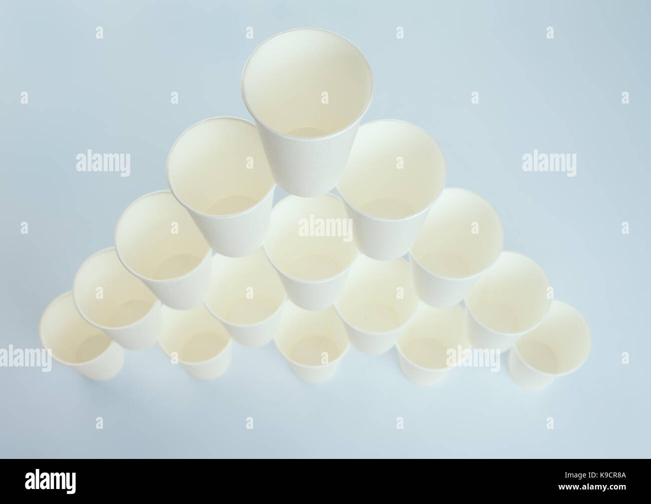 Top view pyramid of white disposable paper cups. Focus on top cup Stock ...