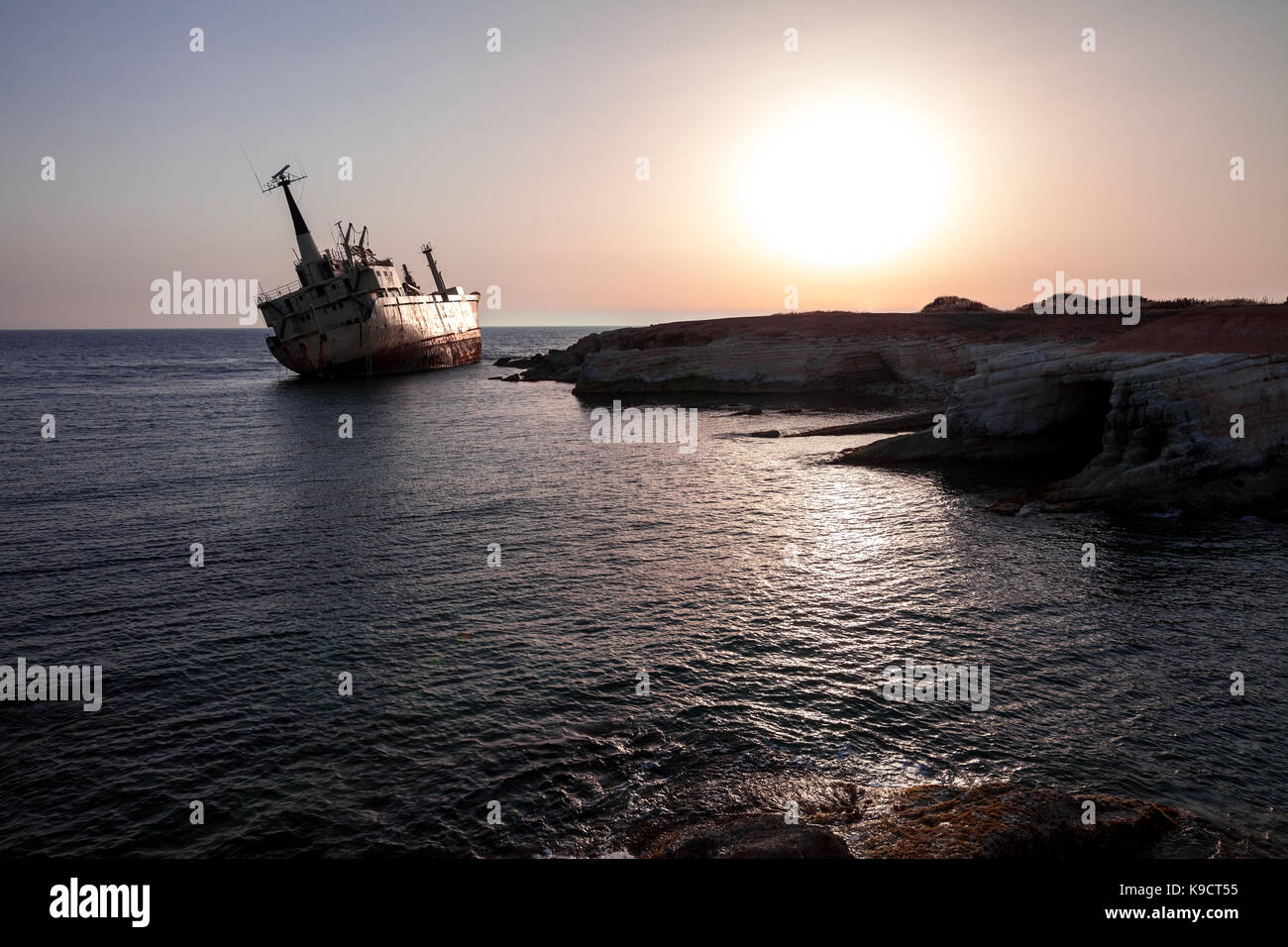 Sinking ship wreck at sunset Stock Photo - Alamy