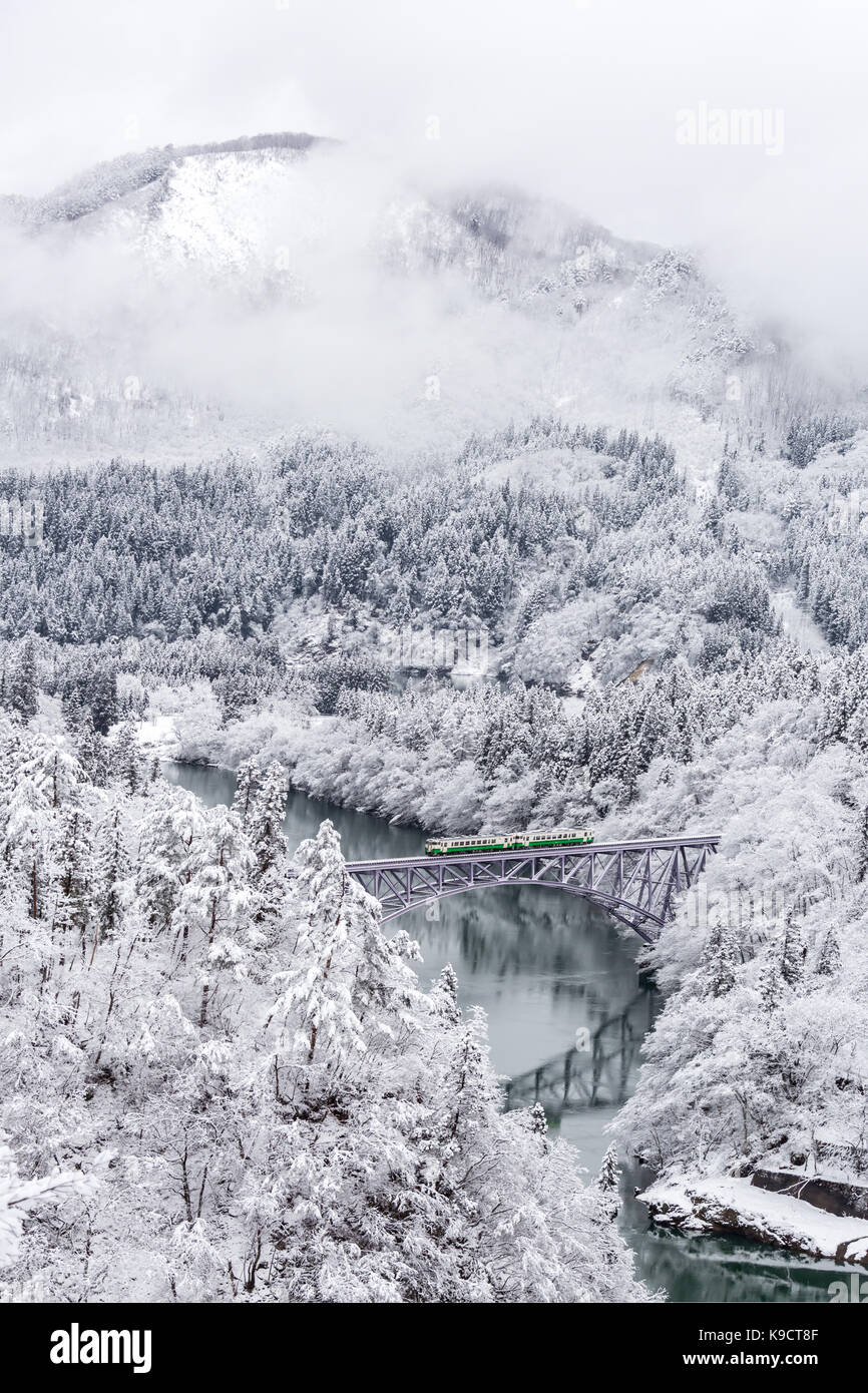 Winter landscape snow covered trees with train crossin River on Bridge ...