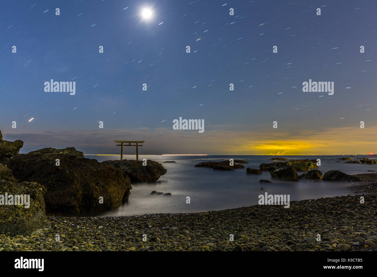 Toroii Japanese shrine gate sunrise at sea Oarai city , Ibaraki Japan ...