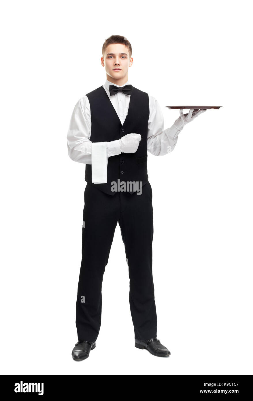 full length portrait of young happy smiling waiter with empty tray ...