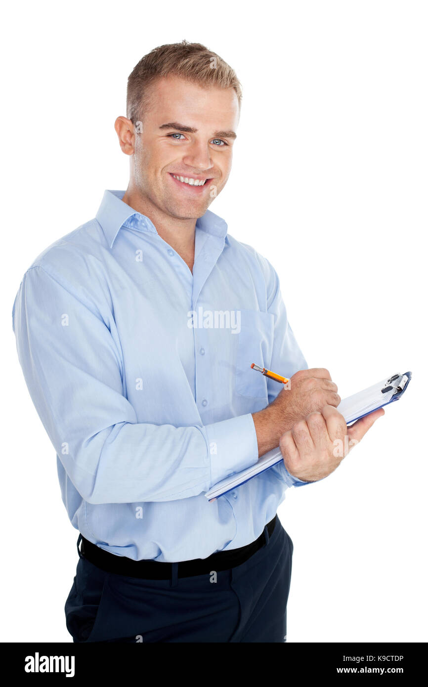 Portrait of young business man taking notes isolated on white ...