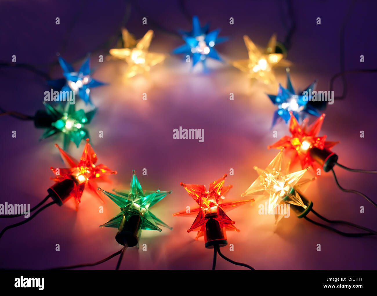 Christmas lights in ring on dark background with copy space.Decorative ...