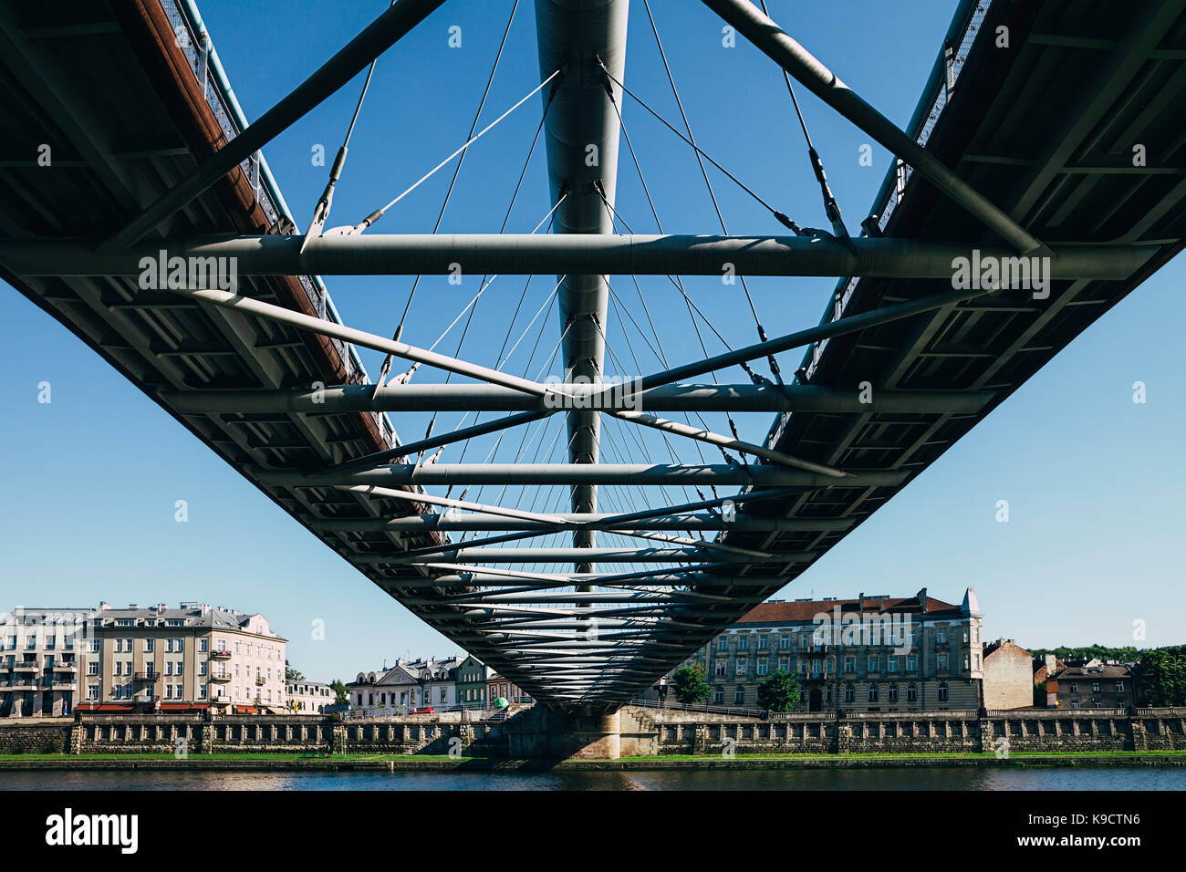 Modern pedestrian bridge in Europe. Perspective view Stock Photo - Alamy