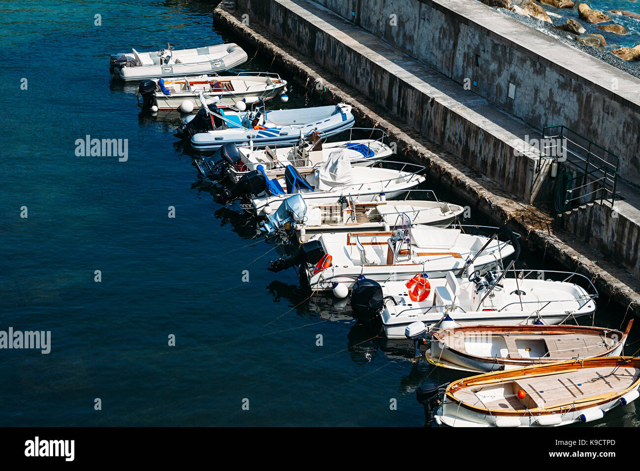 Motor boats and sailboats in harbor. Transportation Stock Photo - Alamy