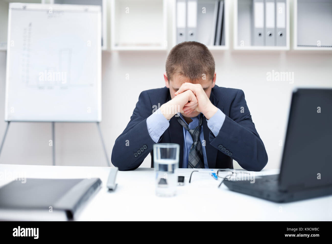 Young business man with problems and stress in the office Stock Photo ...