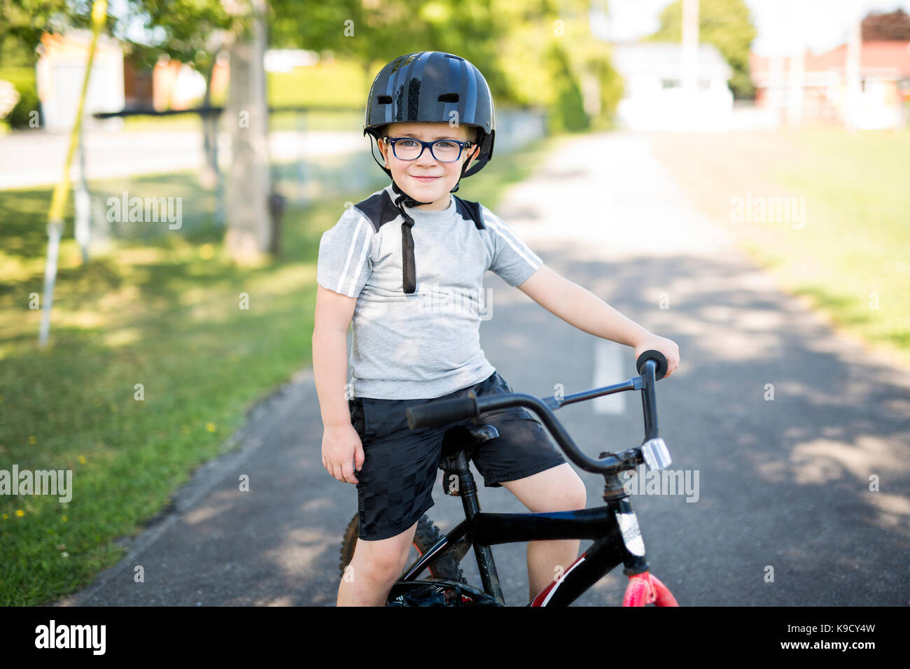 A 6-year old boy biking in the park Stock Photo - Alamy